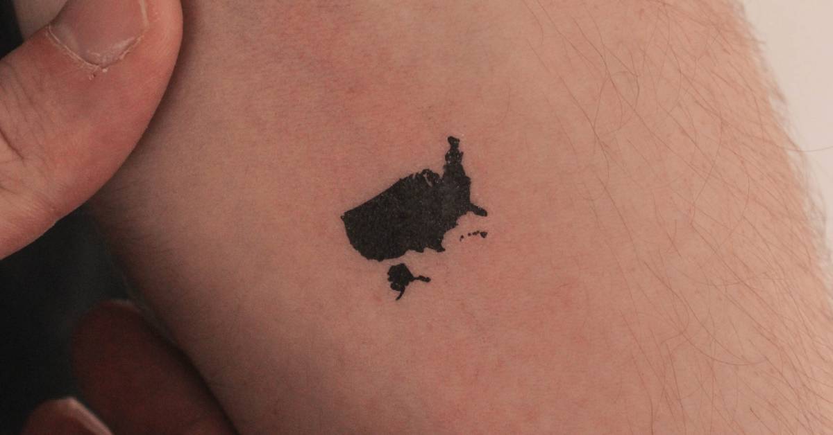 Small United States map temporary tattoo located on the