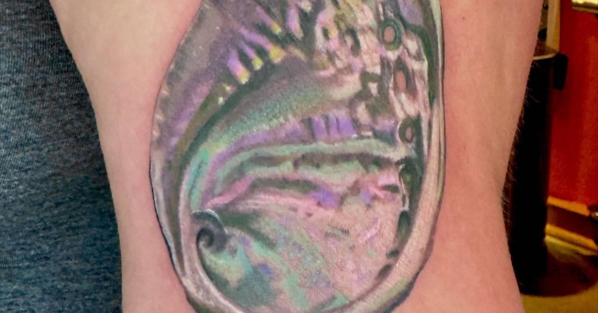 Abalone tattoo located on the bicep, illustrative
