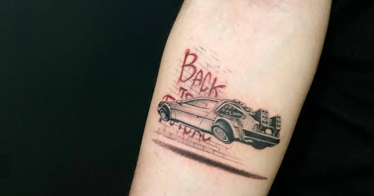 Micro-realistic style DeLorean tattoo located on the