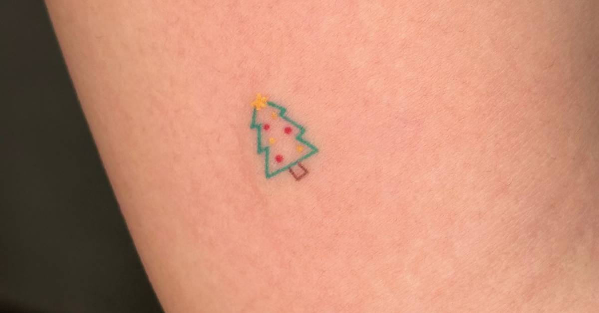 Hand poked minimalistic Christmas tree tattoo placed on