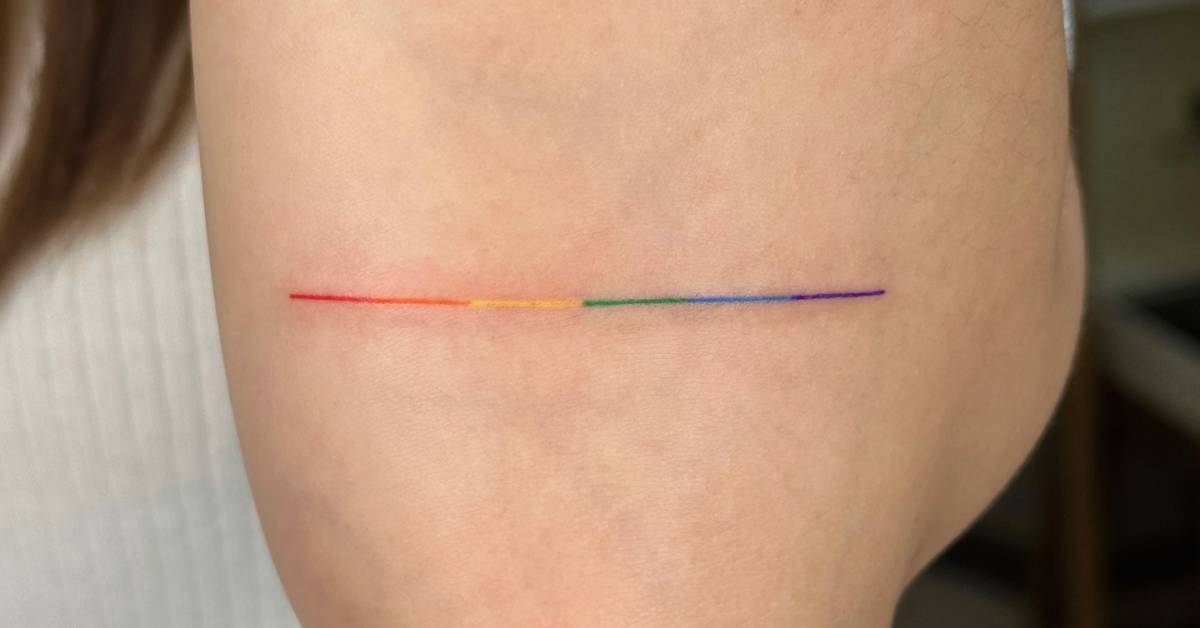 Visible spectrum line tattoo placed on the elbow.