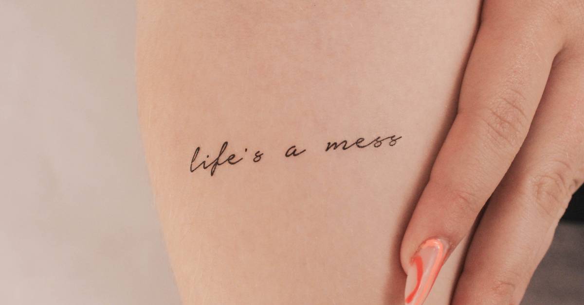 Handwritten font "life's a mess" temporary lettering