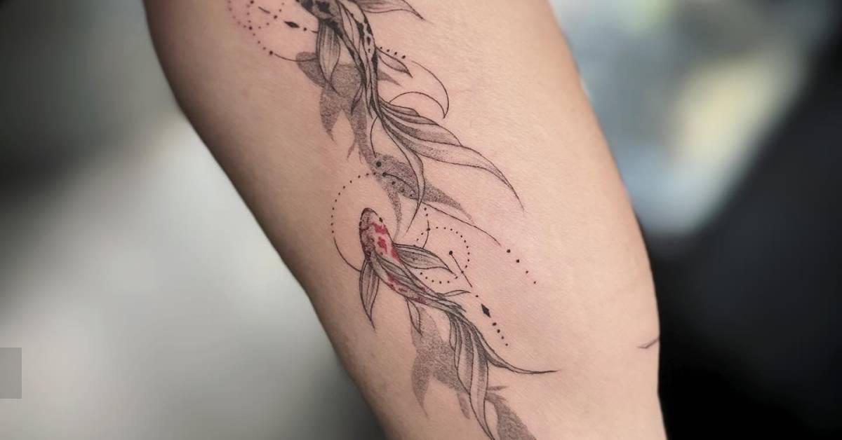 Koi fish tattoo located on the inner arm, graphic