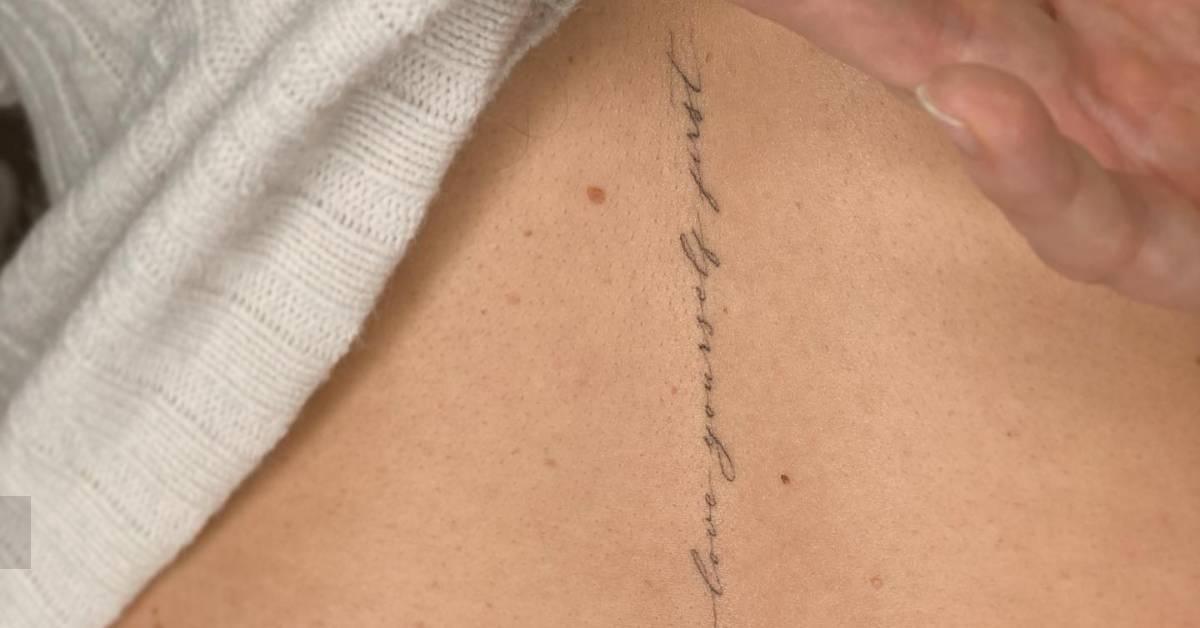 Handwritten lettering tattoo that says "love yourself