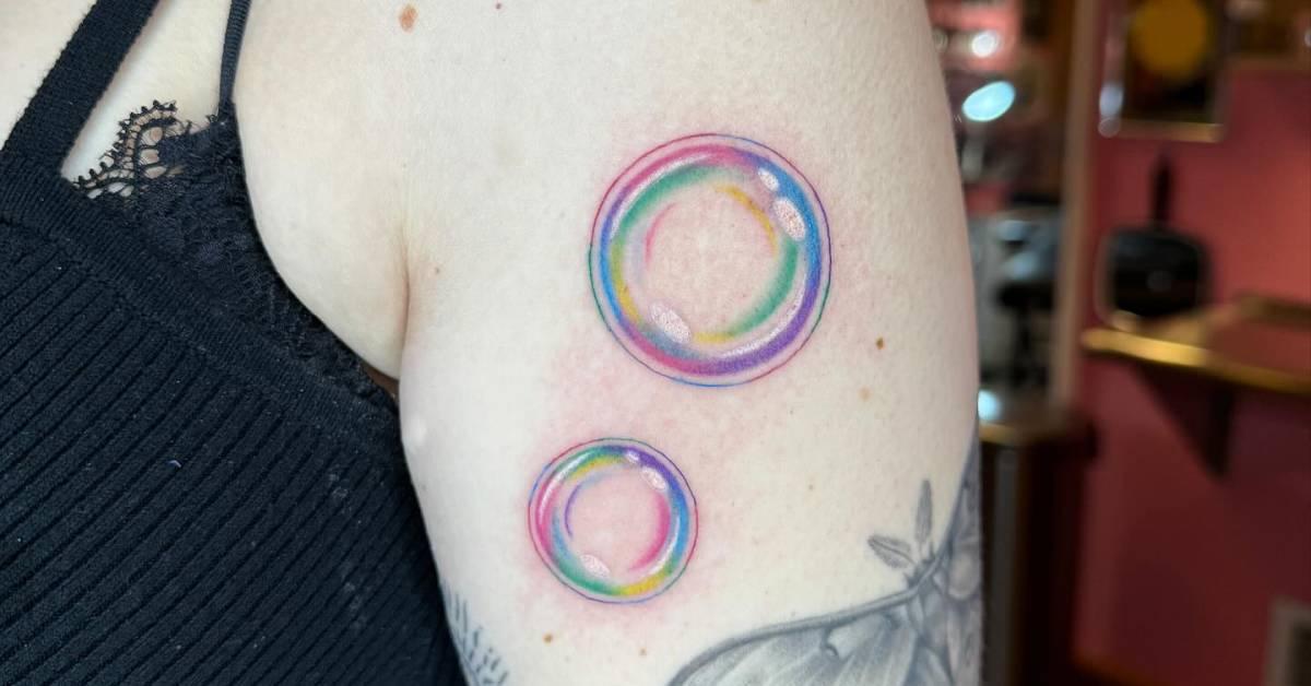 Illustrative style soap bubbles tattoo placed on the