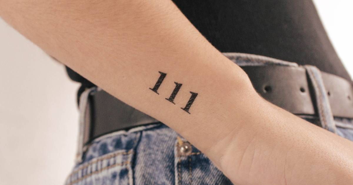 "111" angel number temporary tattoo located on the
