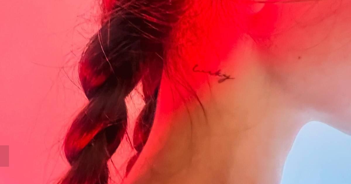 Word "lucky" lettering tattoo located on Maddison