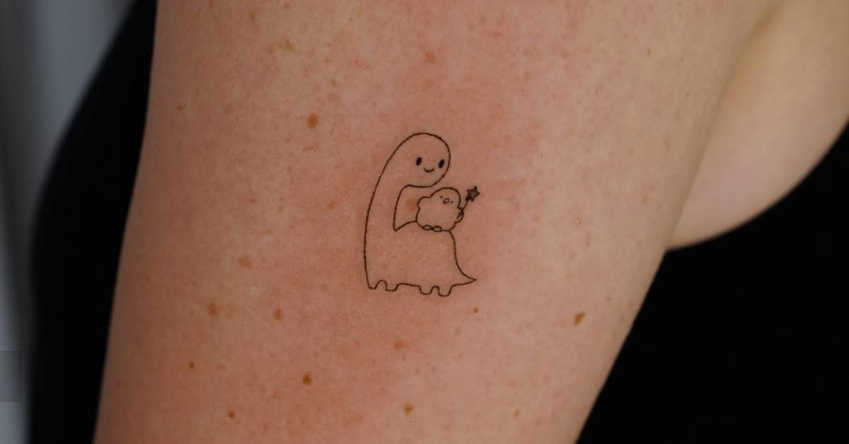 Fine line style diplodocus tattoo located on the upper