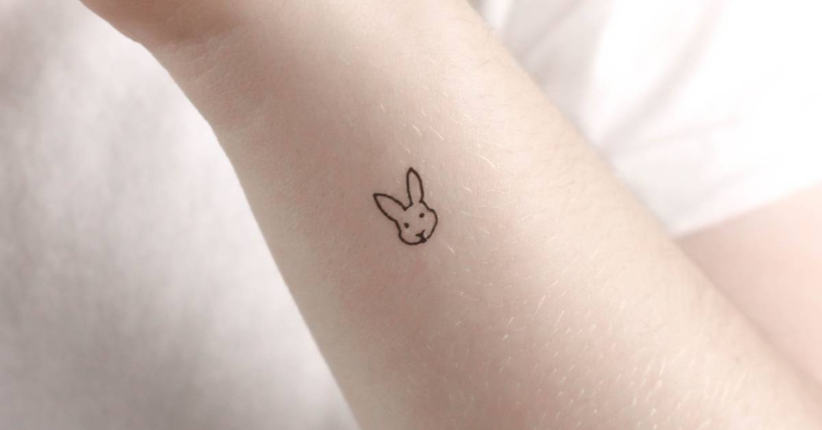 Tiny minimalistic rabbit face temporary tattoo placed