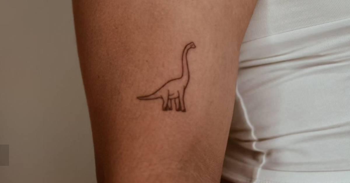Minimalistic style brontosaurus tattoo located on the