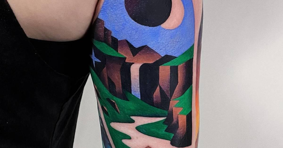 Nature landscape tattooed on the tricep, contemporary