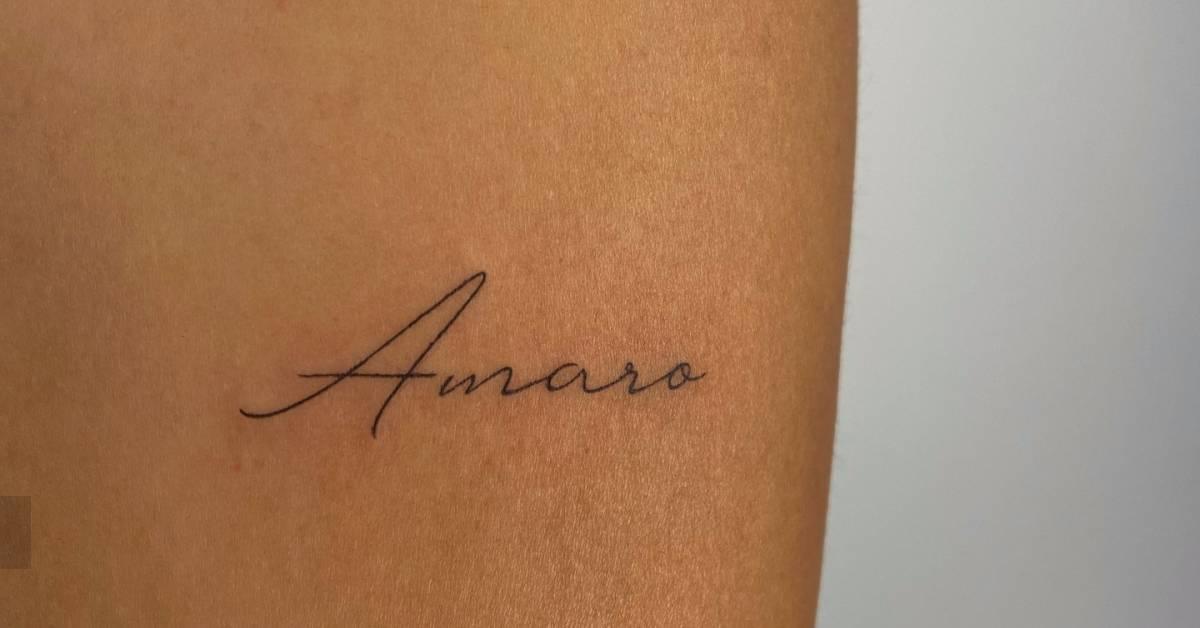 Handwritten lettering tattoo of the name "Amaro"