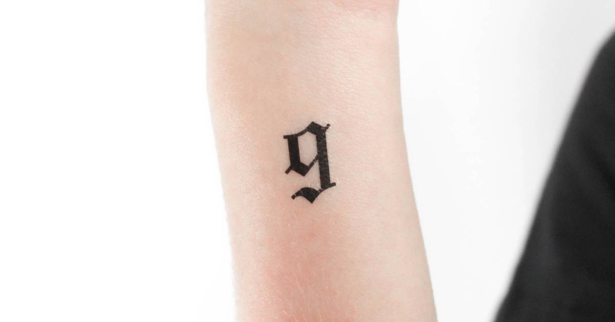 Gothic style number "9" temporary tattoo located on the