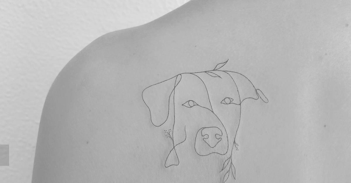 One line Labrador portrait tattoo located on the