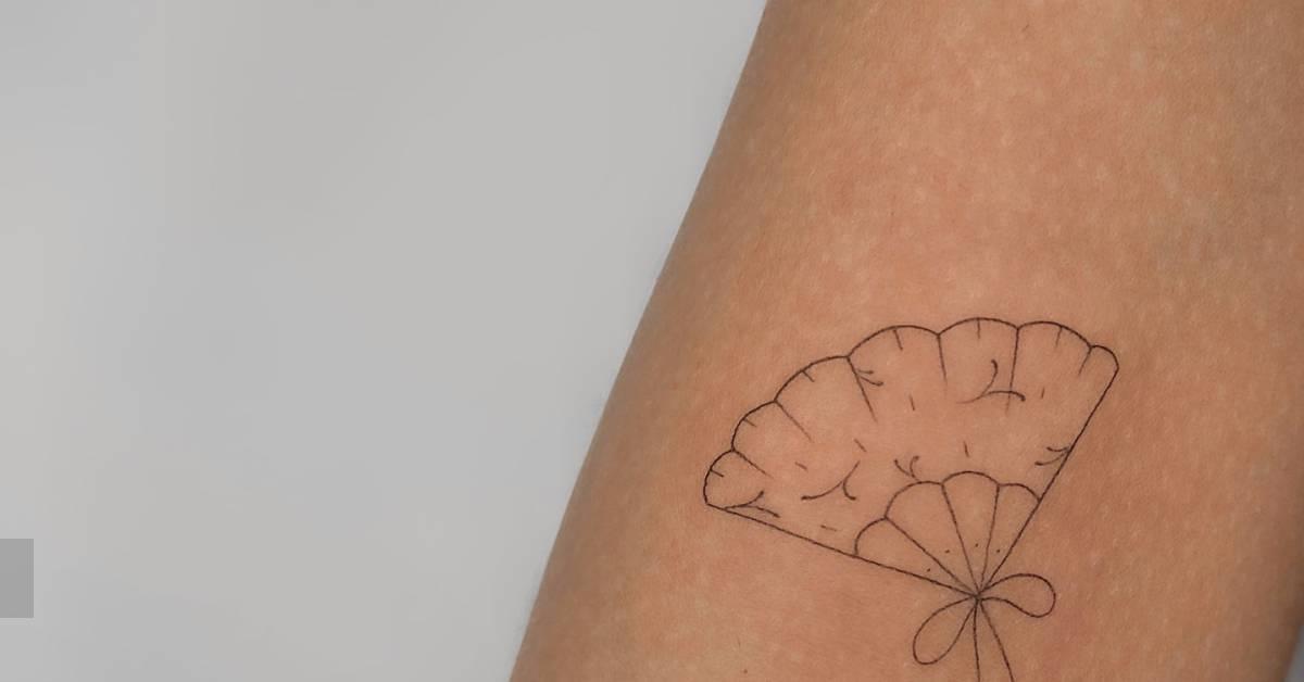 Fine line tattoo of a hand fan located on the inner