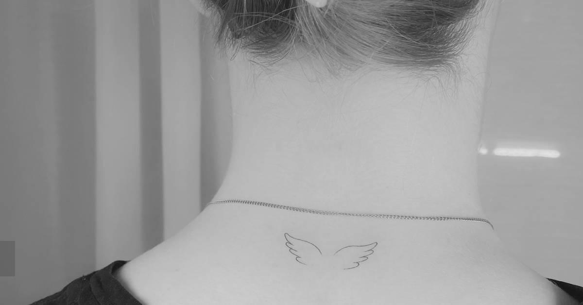 Angel wings tattoo placed on the upper back,