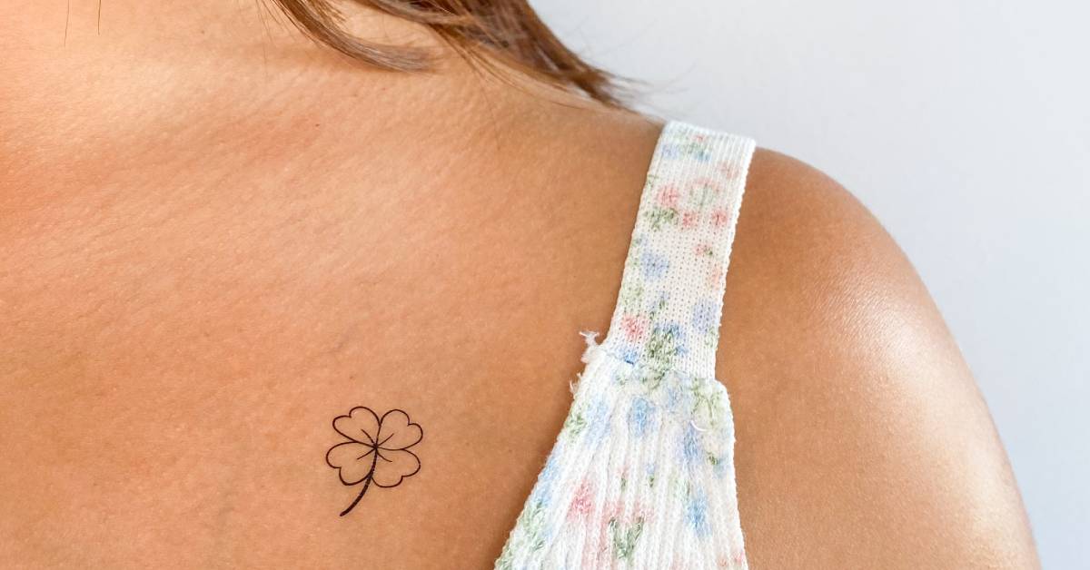 Fine line style four leaf clover temporary tattoo.