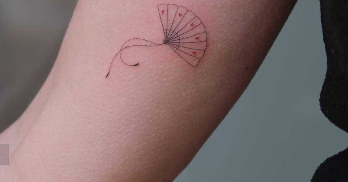 Hand fan tattoo placed on the inner arm, done in fine