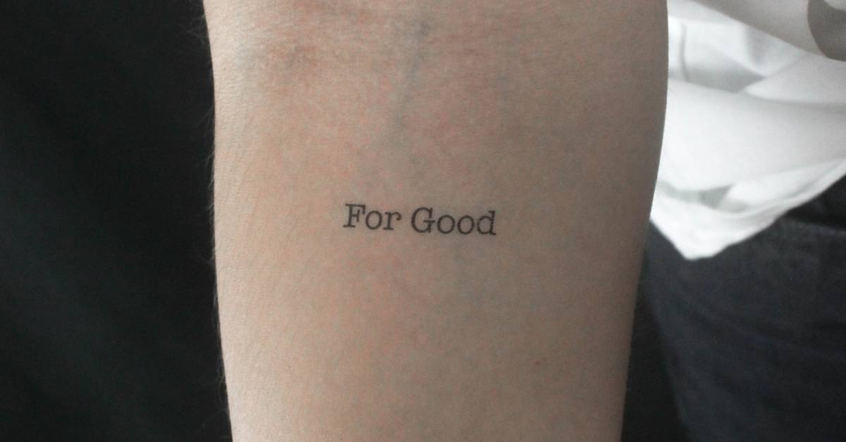 "For Good" temporary lettering tattoo in typewriter