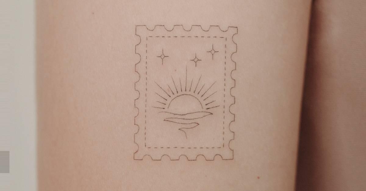 Fine line style sea sunset stamp tattoo placed on the