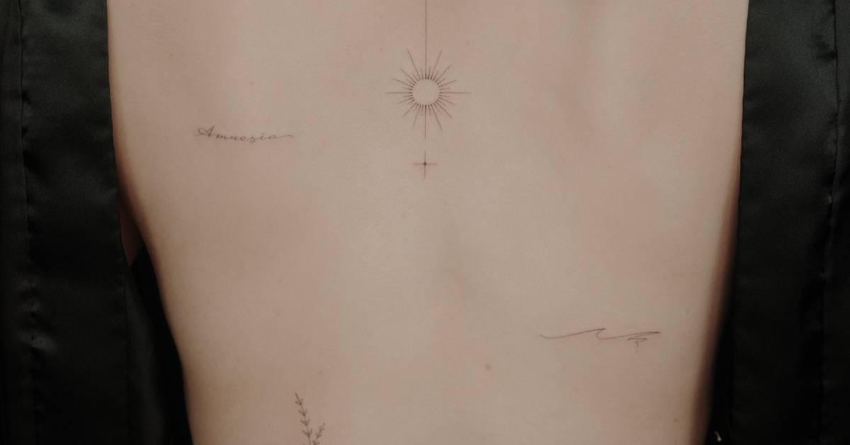 Back composition tattoo in fine line style.