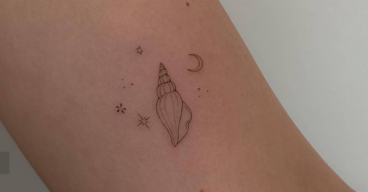 Tulip shell in fine line style tattooed on the inner