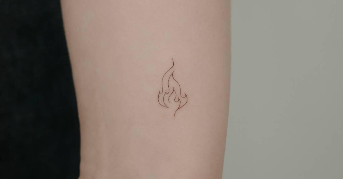 One line fire tattoo located on the wrist.