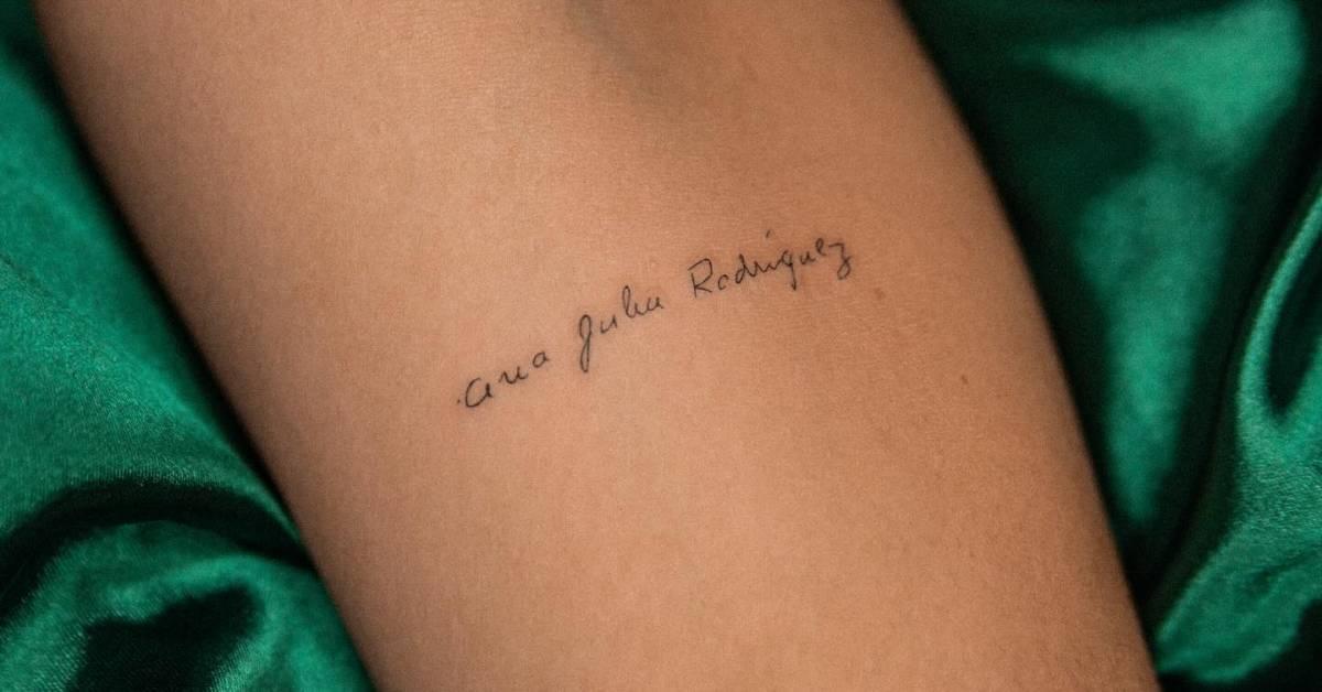 Signature tattoo located on the inner forearm.