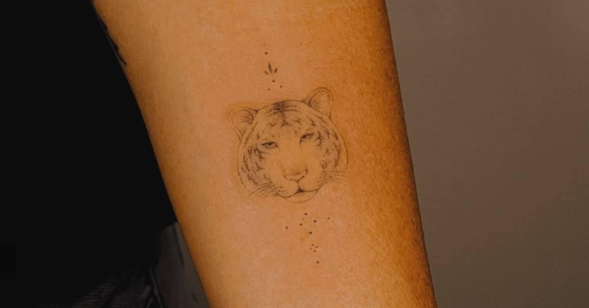 Tiger portrait tattoo in fine line style located on the