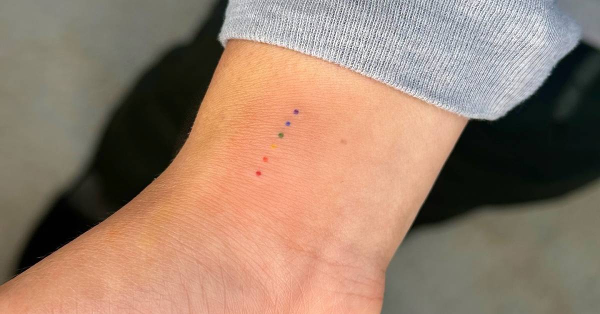 Visible spectrum dots tattooed on the wrist,