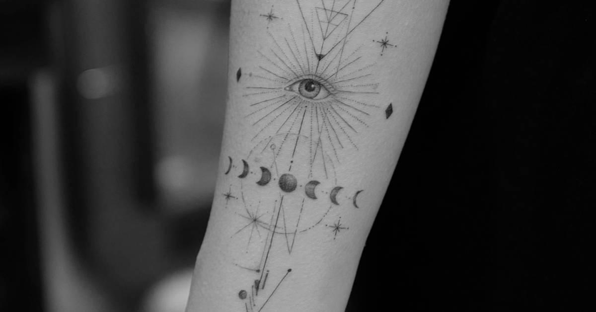 Graphic style forearm composition tattoo.