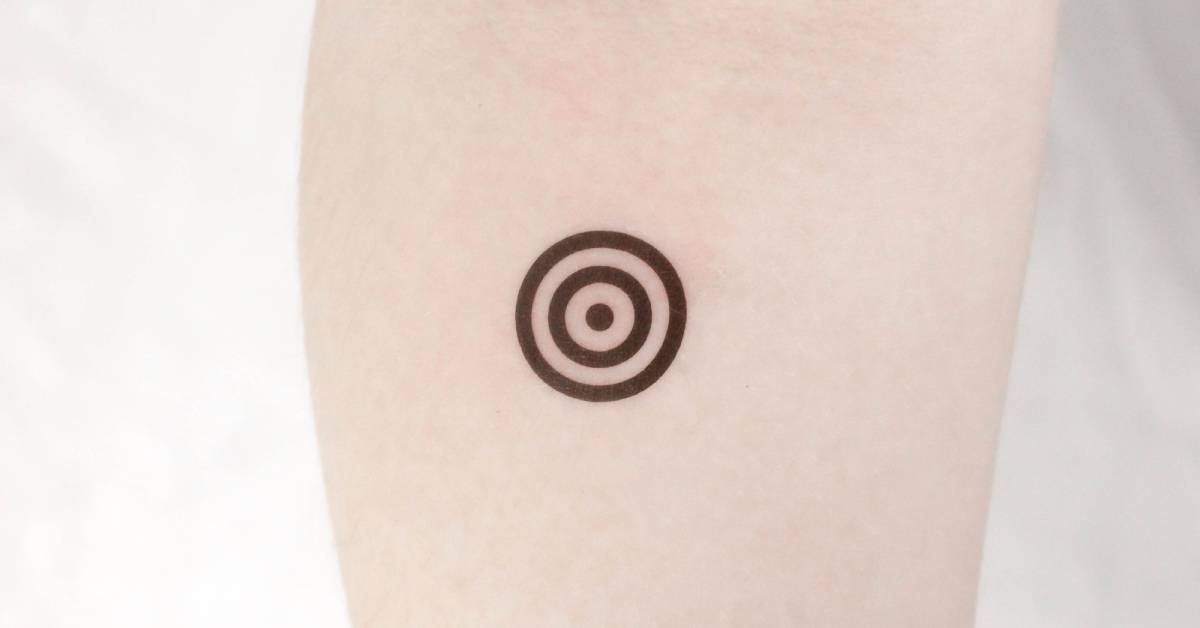 Minimalistic style target temporary tattoo located on