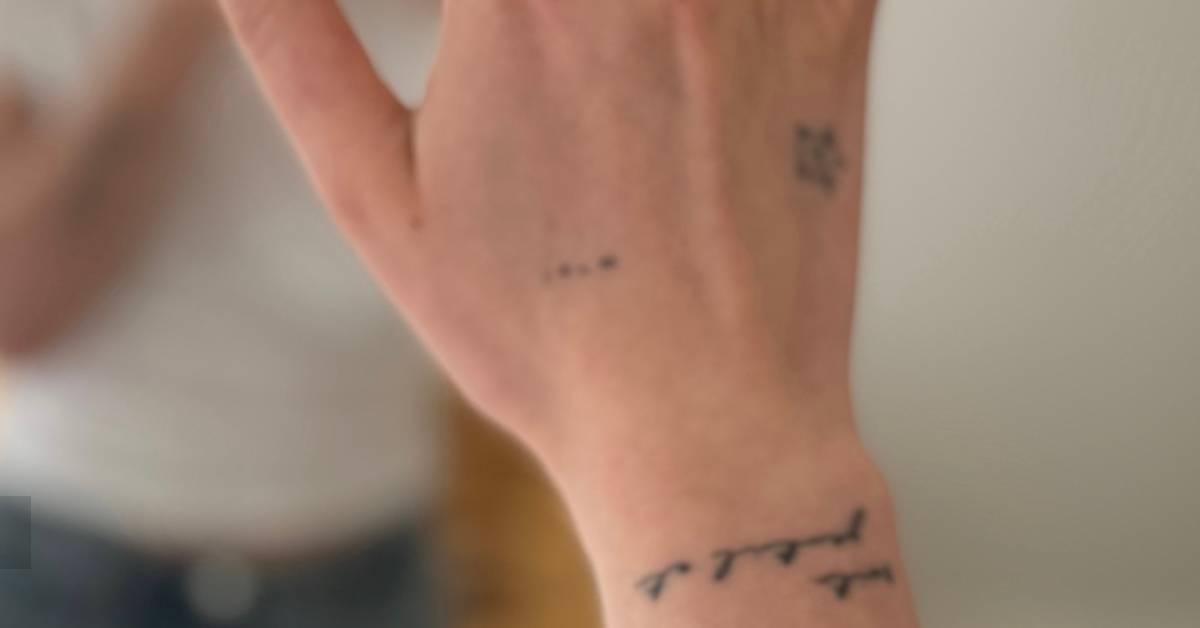 Love letter tattoo in fine line style located on the