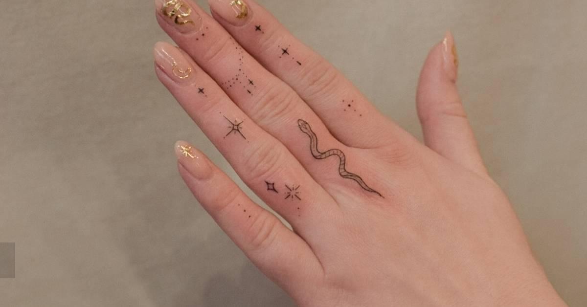 Finger composition tattoos in fine line style.