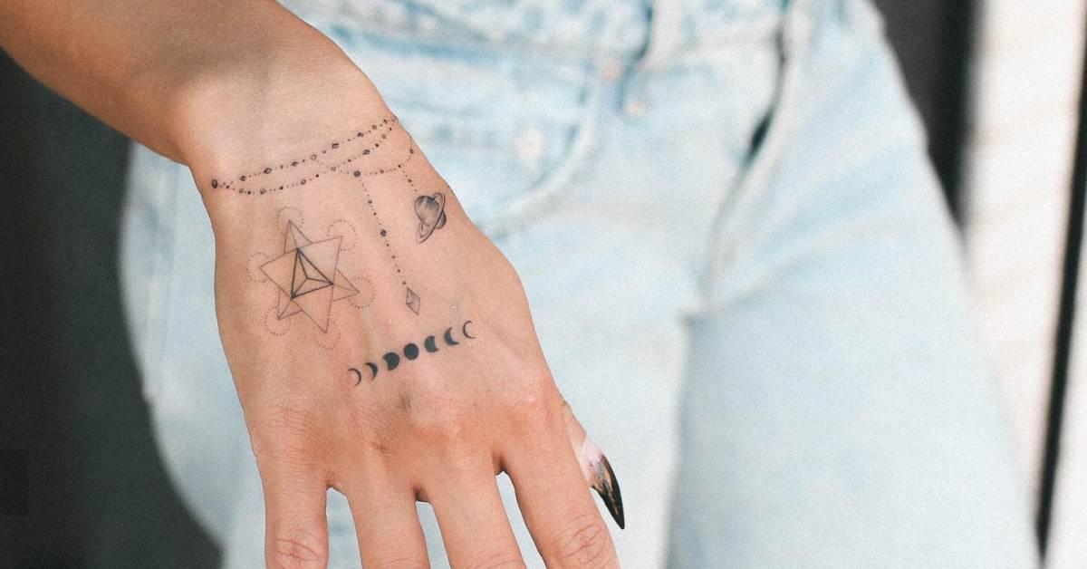 Graphic style hand composition tattoos.