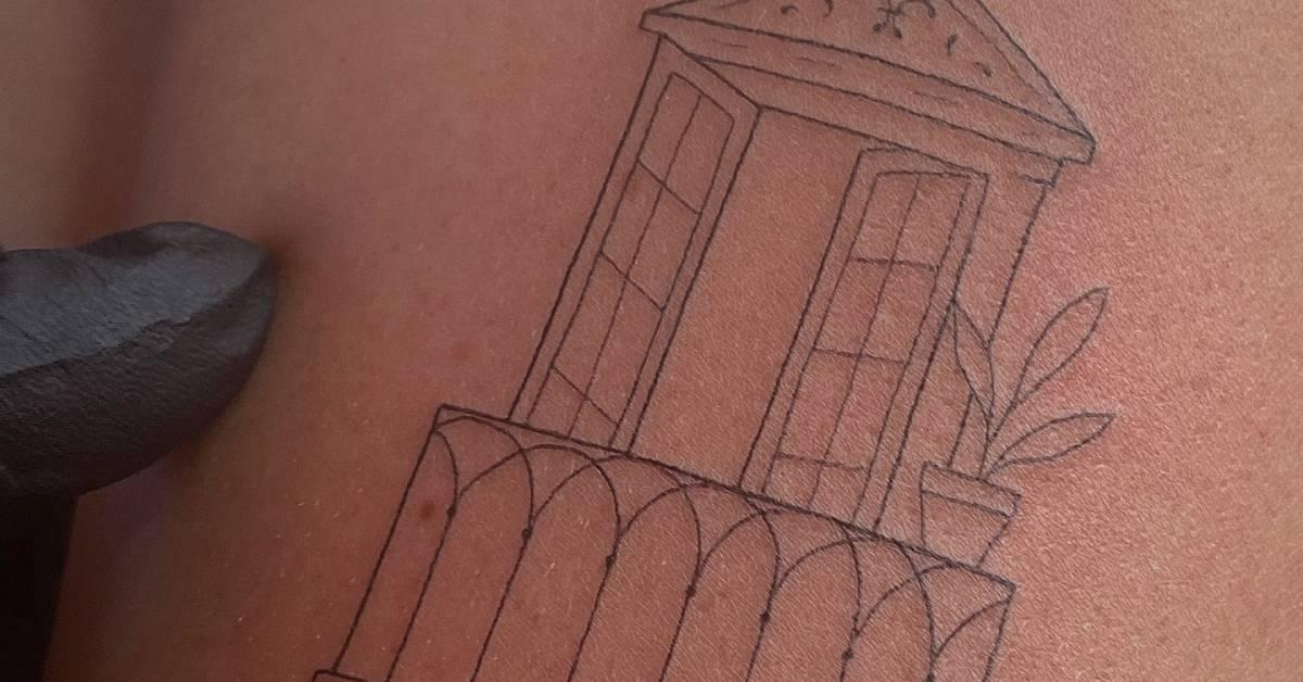 Fine line style balcony tattoo located on the upper