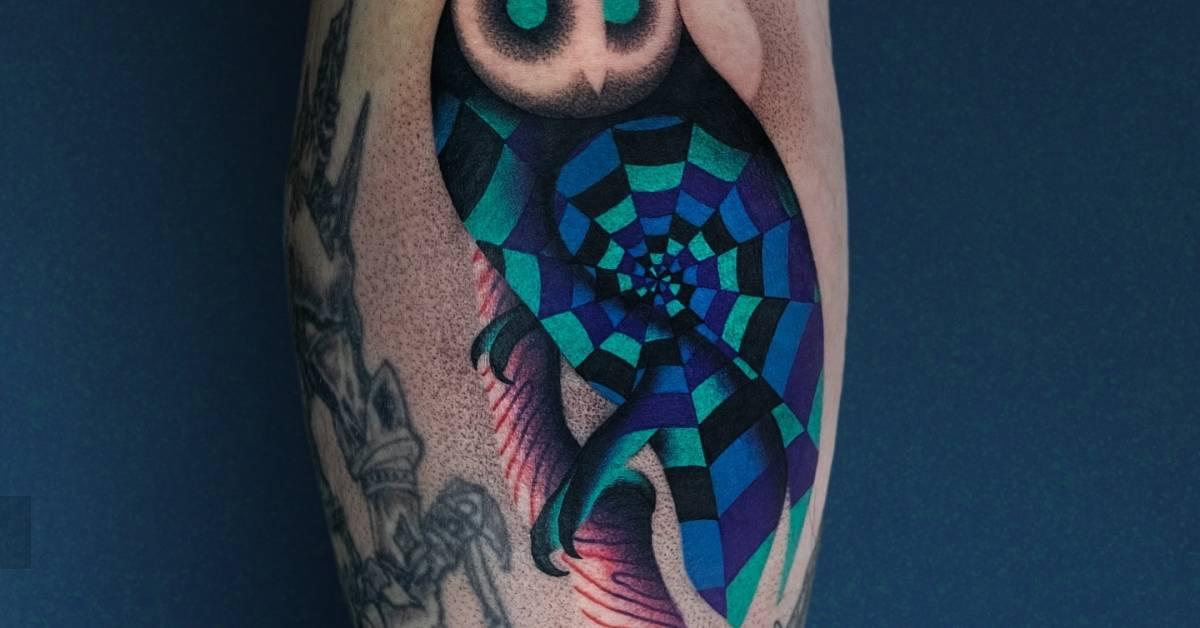 Barn owl tattoo located on the calf, pop art style.