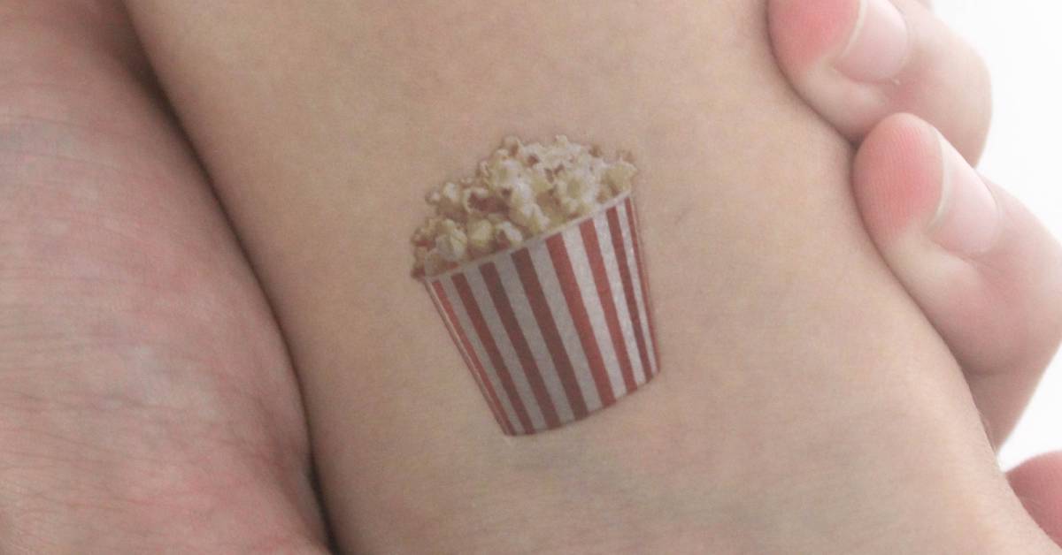 Realistic style popcorn temporary tattoo located on the