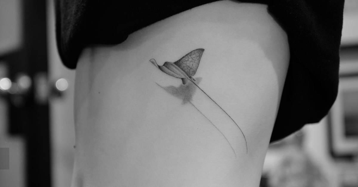 Micro-realistic style spotted eagle ray tattoo located