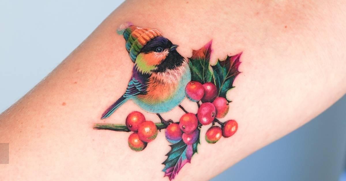 Chickadee tattoo in micro-realistic style located on