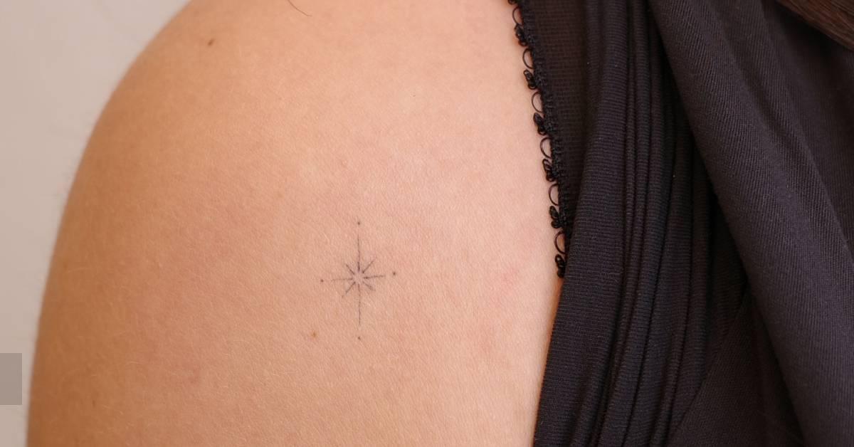 Healed fine line style North Star tattoo located on the