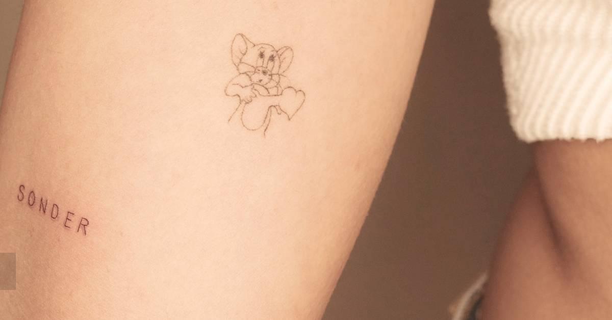 Fine line style Jerry tattoo located on the inner arm
