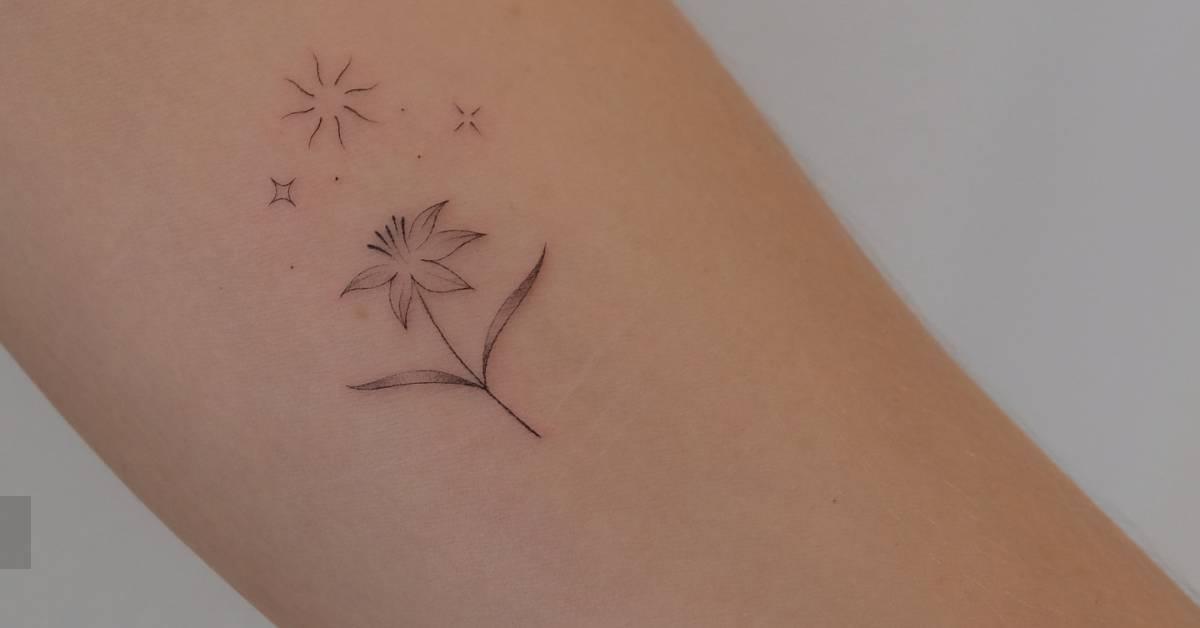 Fine line style daffodil tattoo placed on the inner