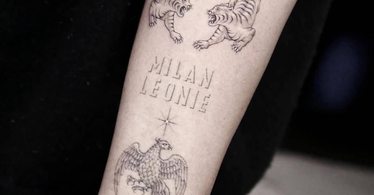 Graphic style forearm composition tattoos.