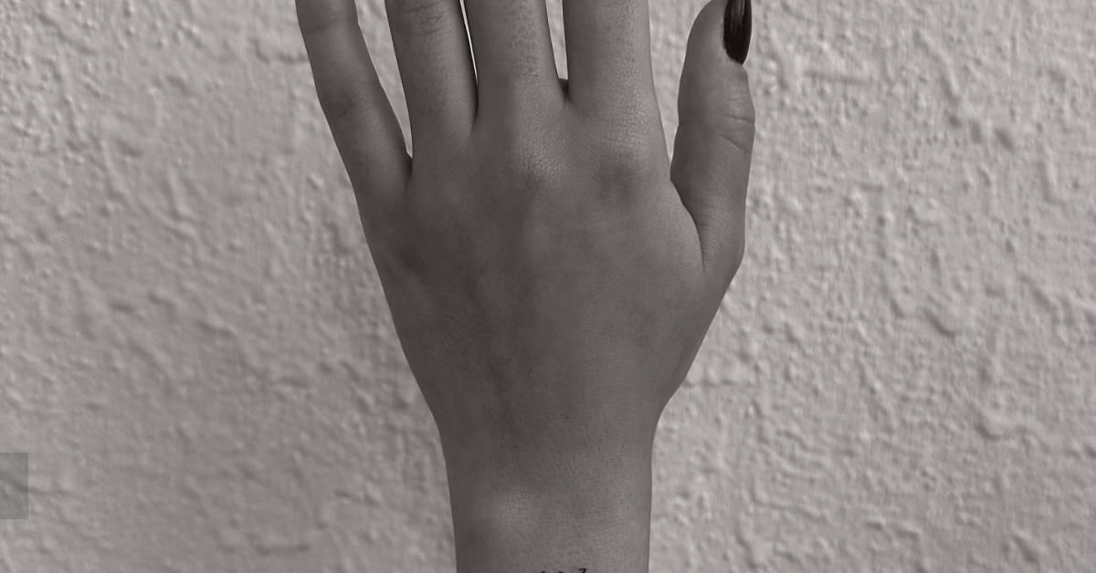 Little number "123" tattoo located on the wrist.