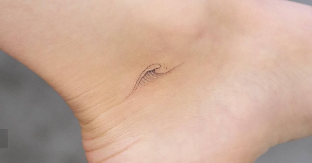 Single needle wave tattoo located on the ankle.