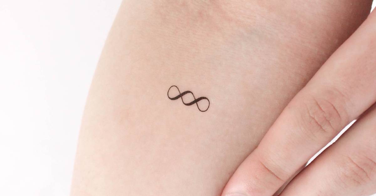 Small double infinity symbol temporary tattoo located