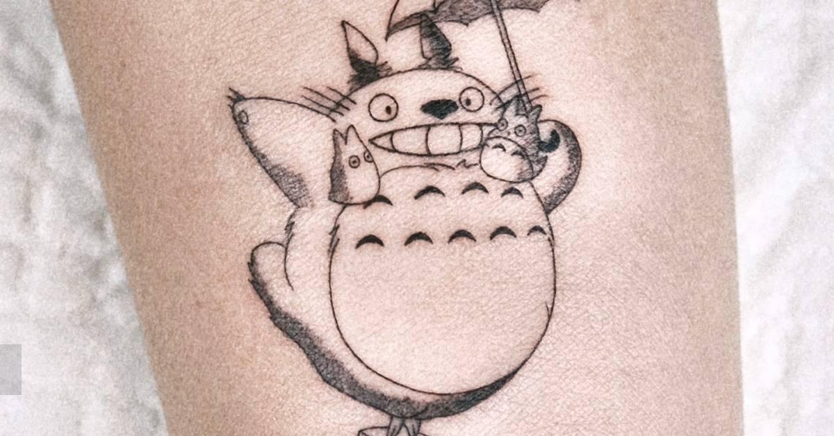 Cartoon style Totoro tattoo located on the inner