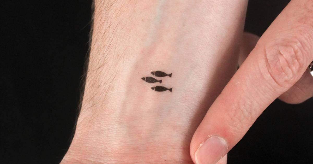 Minimalistic style three little fish temporary tattoo