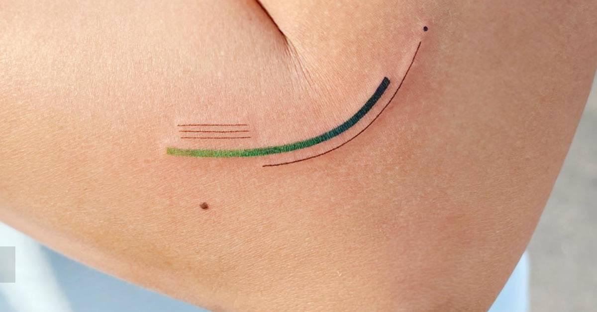 Abstract geometric tattoo located on the elbow.